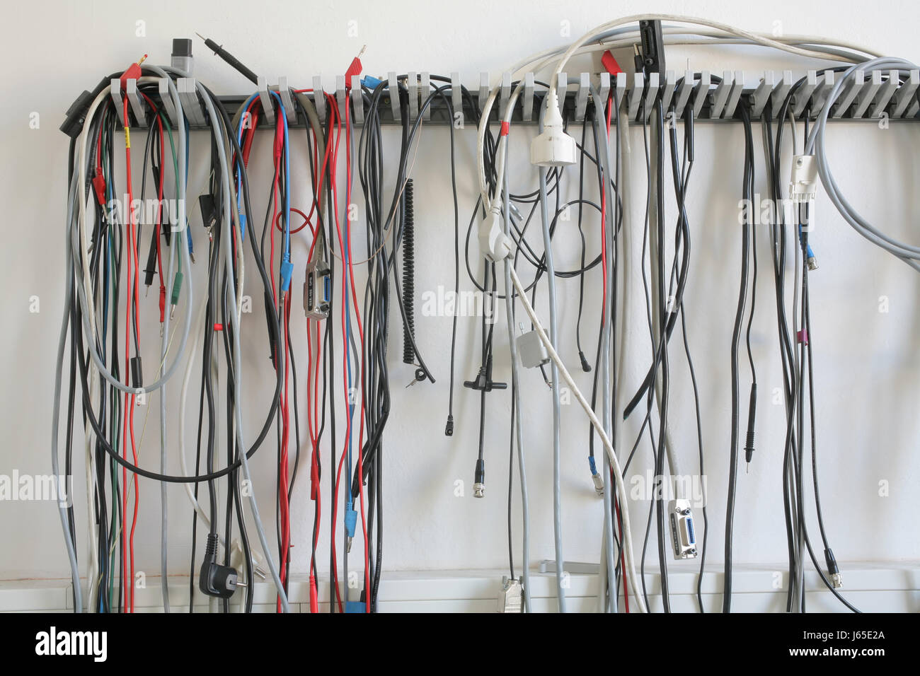 cable to the wall Stock Photo - Alamy