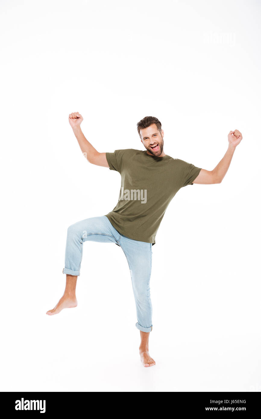 Picture of smiling young man standing isolated over white background ...