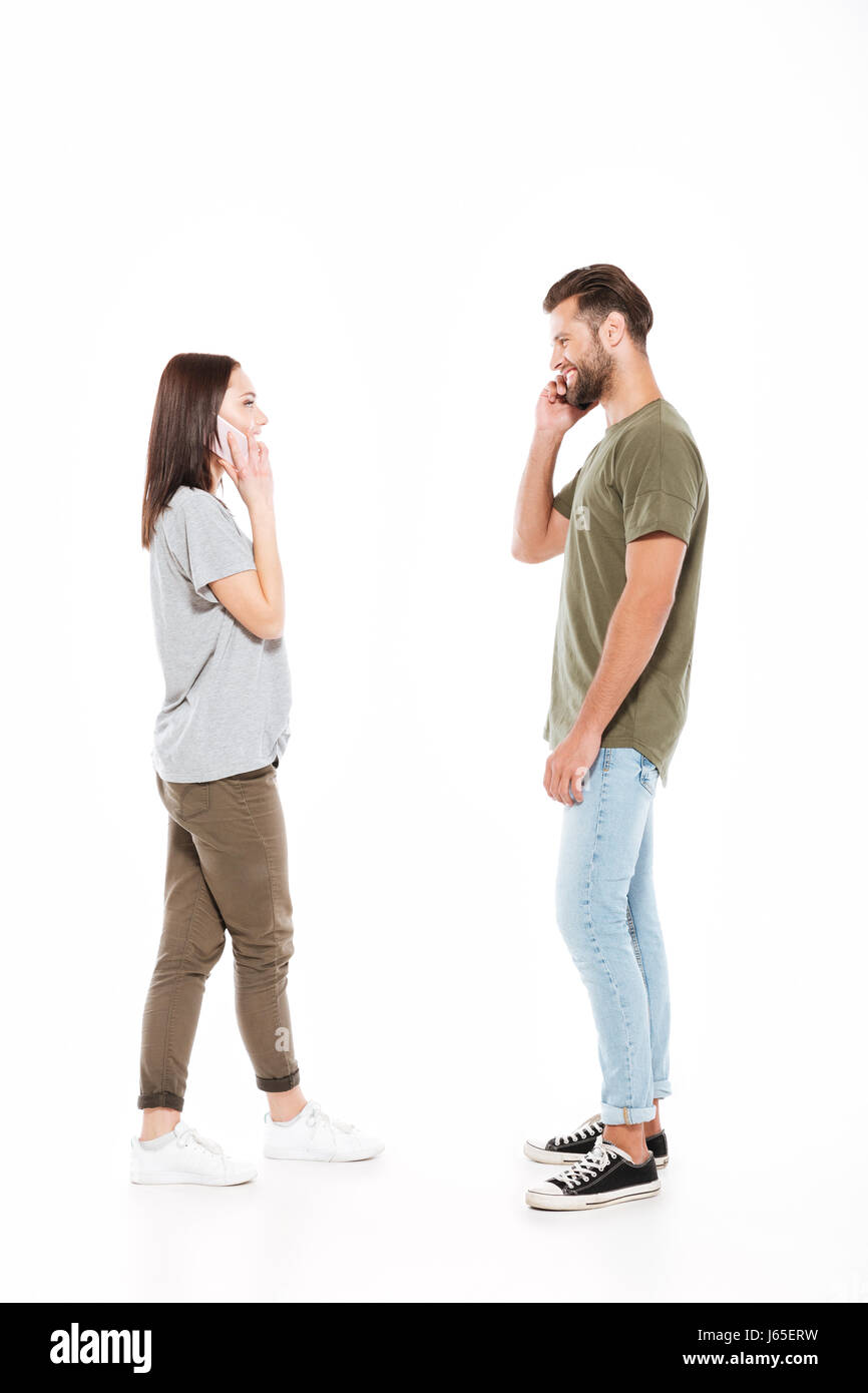 Image of happy young loving couple standing isolated over white ...