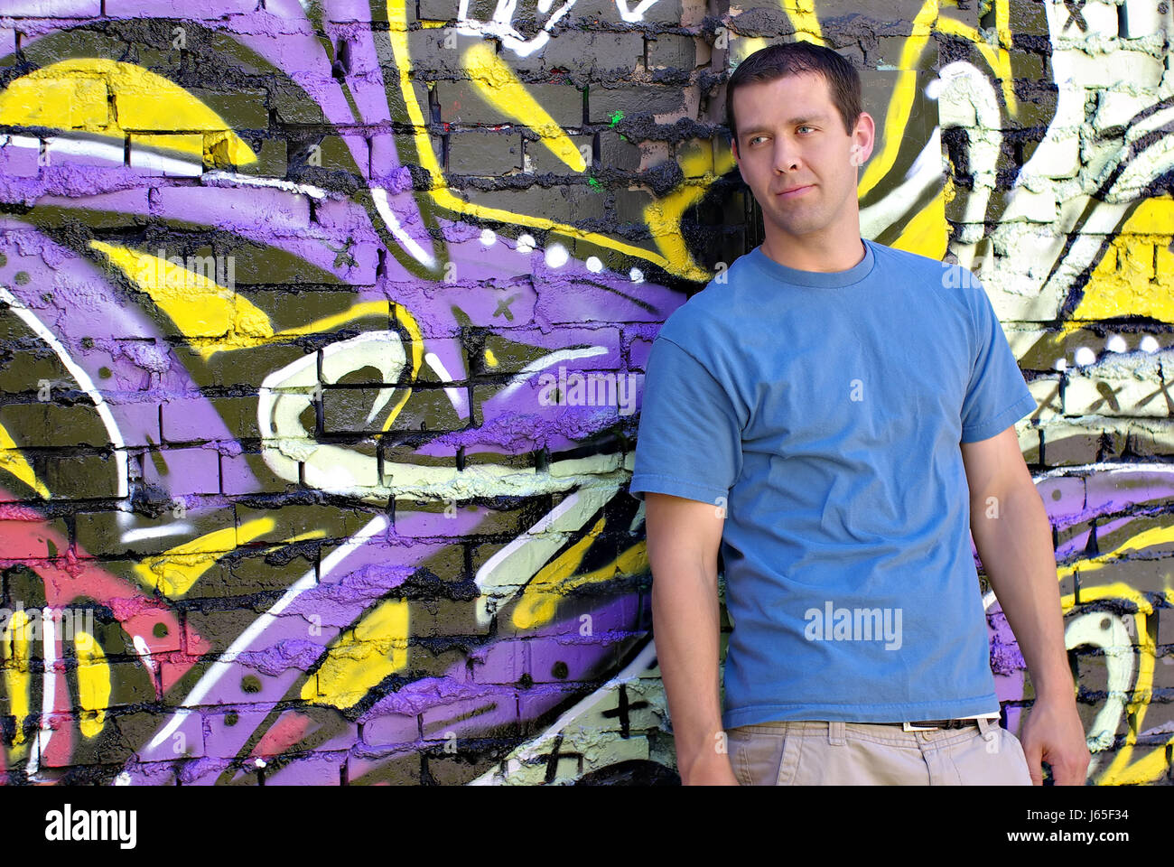 male masculine wall daub graffiti grafitti paint color man guy laugh ...