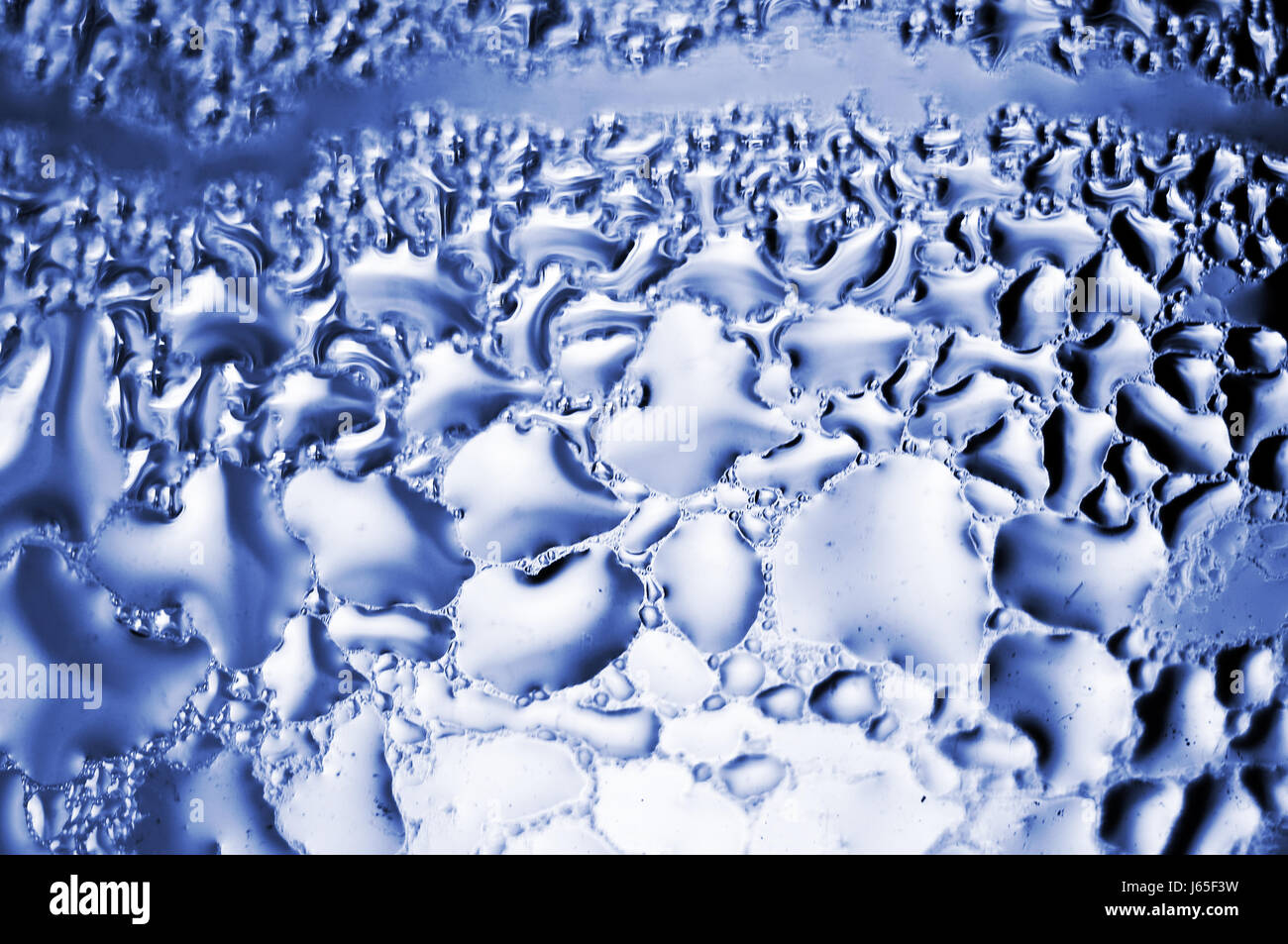 closeup versed abstract glassy backdrop background water drop drip ...