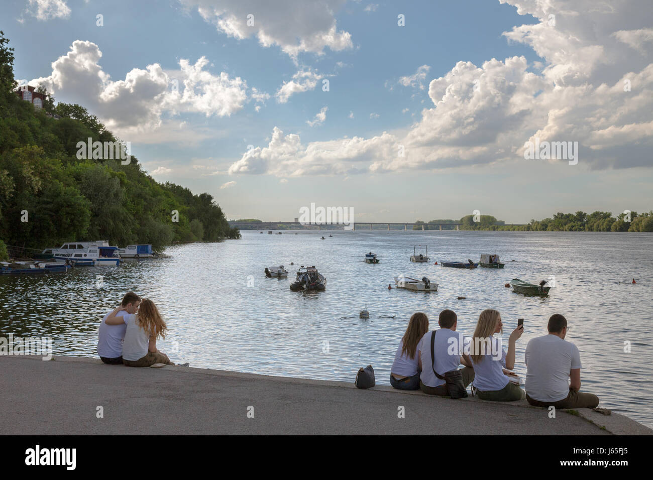 BELGRADE, SERBIA - MAY 13, 2017: Young people sitting on Zemun Quay ...