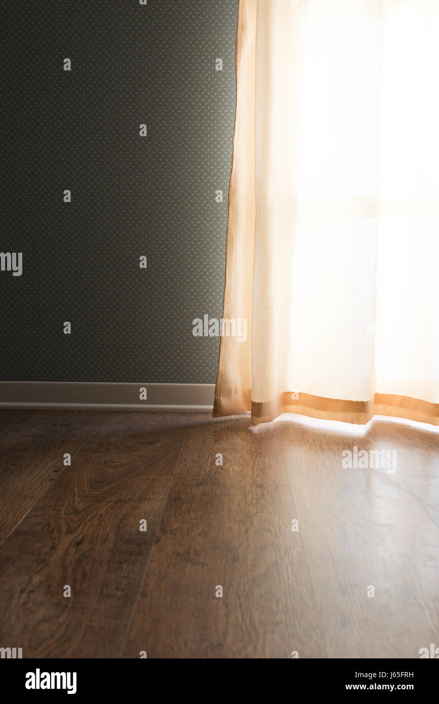 Elegant vintage interior with hardwood floor, window with curtain and ...
