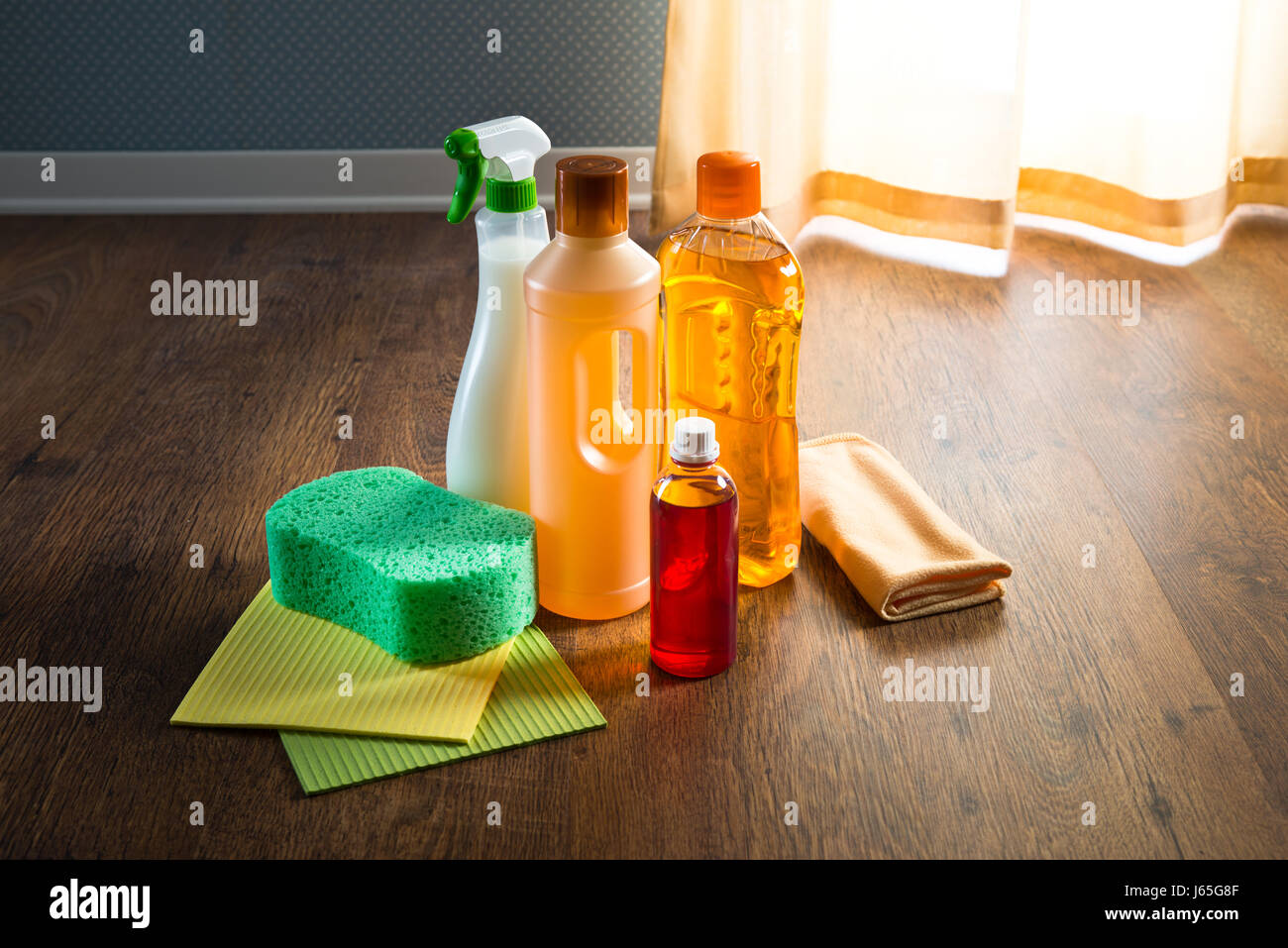 Wood floor cleaner products on parquet with sponges and microfiber ...