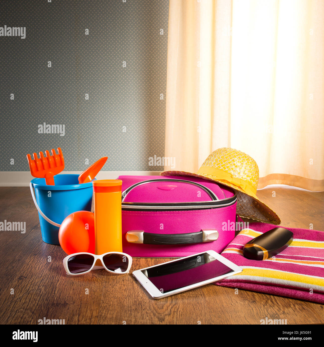 Summer vacations packing with colorful accessories and digital tablet ...