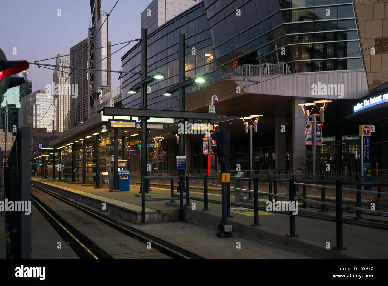 Railway station platform amidst modern office buildings at Downtown ...
