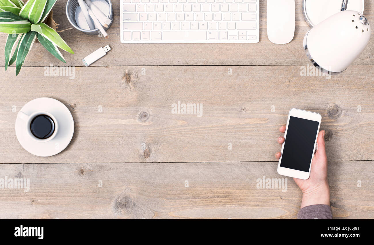 Home office desk with smartphone Stock Photo - Alamy