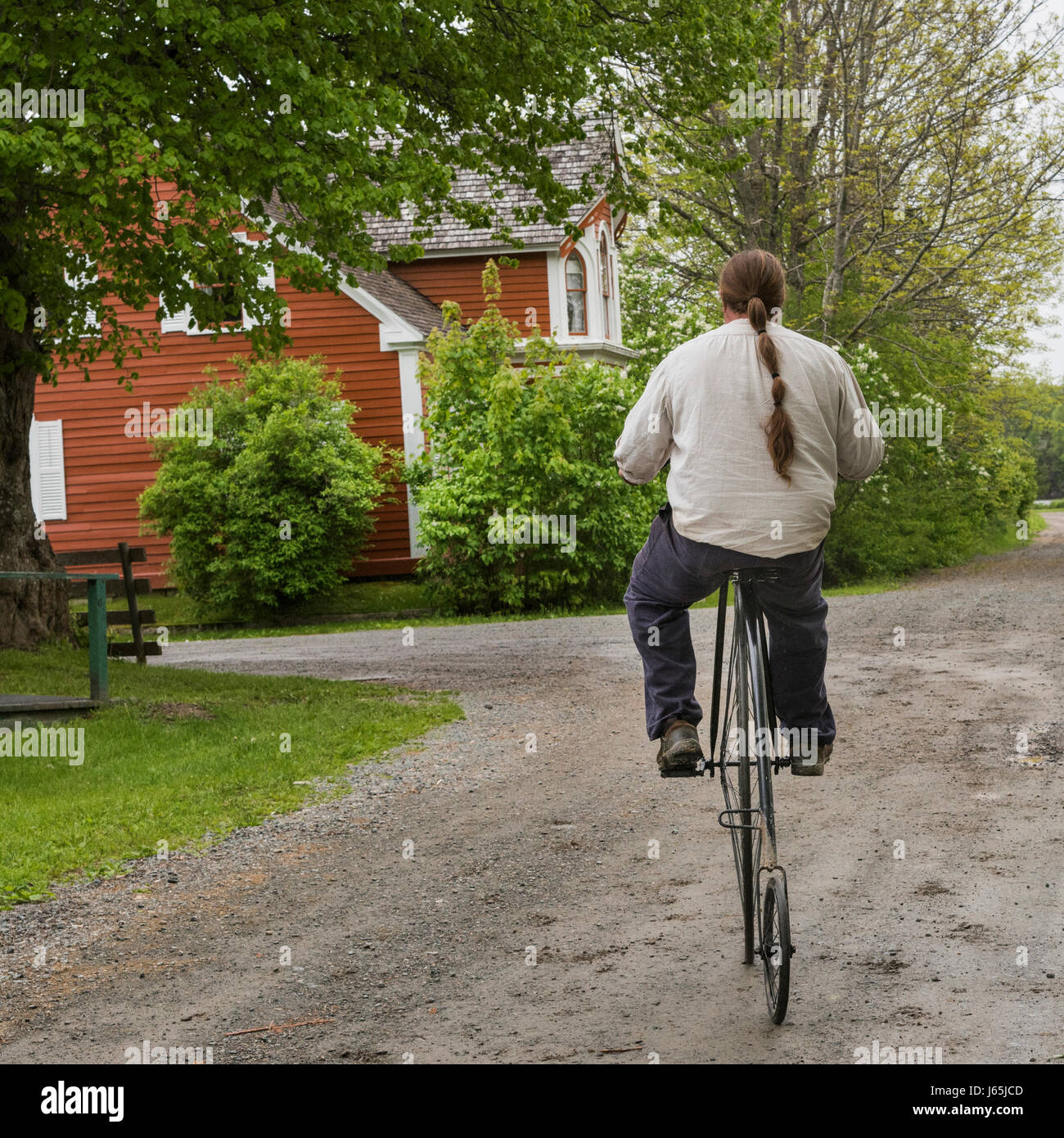 Man riding penny farthing hi-res stock photography and images - Alamy
