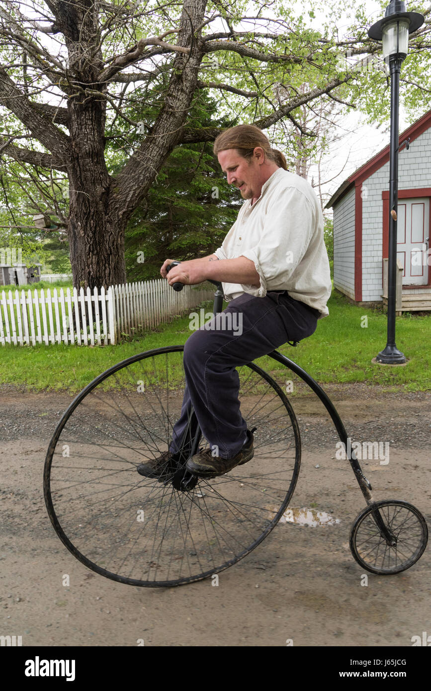 Man riding penny farthing bicycle, Sherbrooke, Nova Scotia, Canada ...