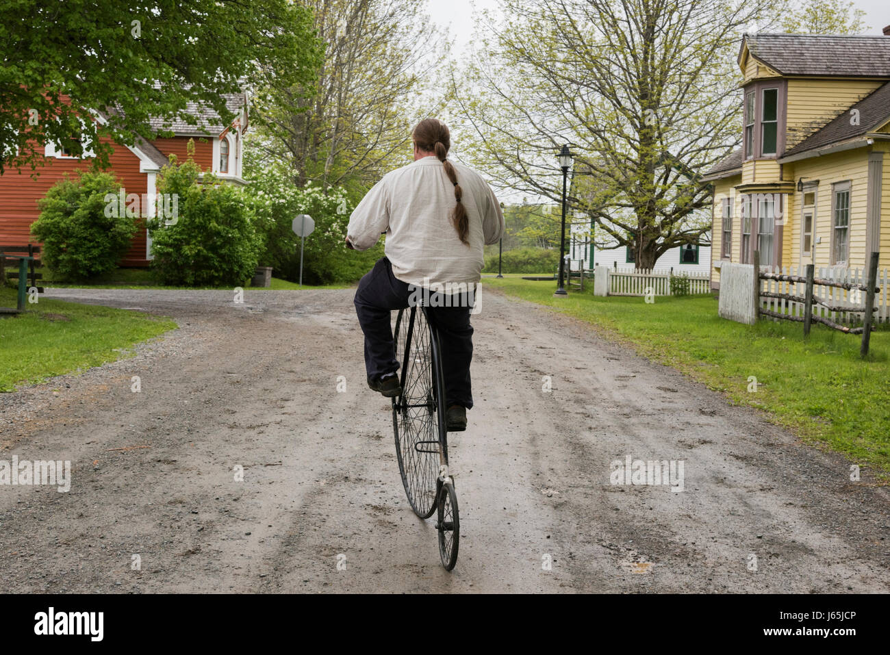 Man riding penny farthing hi-res stock photography and images - Alamy