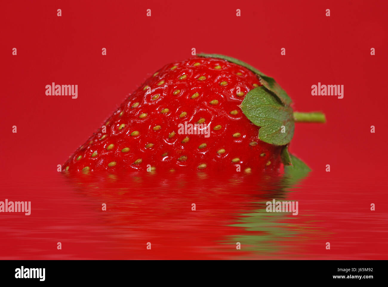 strawberry red background Stock Photo - Alamy