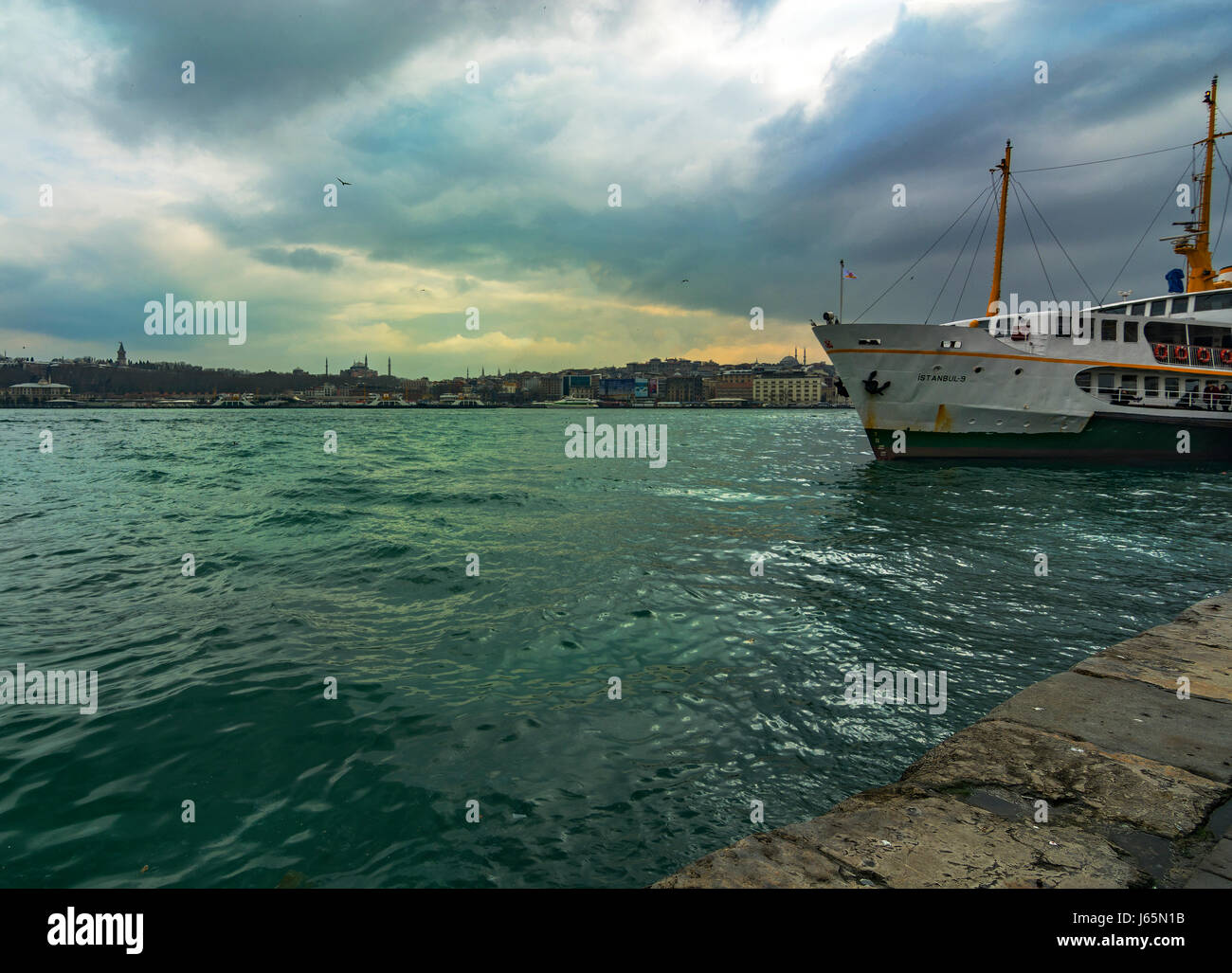 Galata bridge and ferry Stock Photo - Alamy
