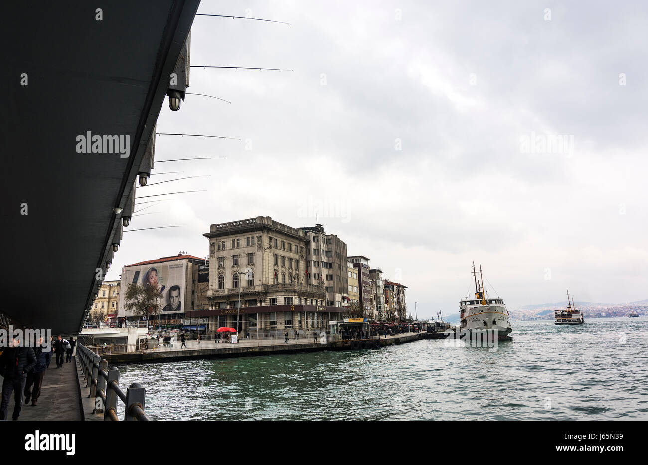 Galata bridge and ferry Stock Photo - Alamy