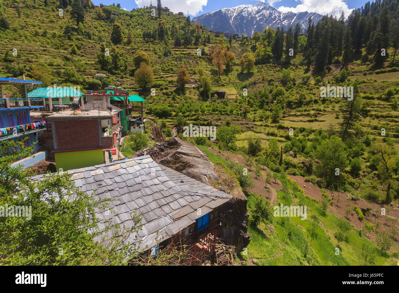 Small village Raskat with slate roofed stone house, surounded by green ...