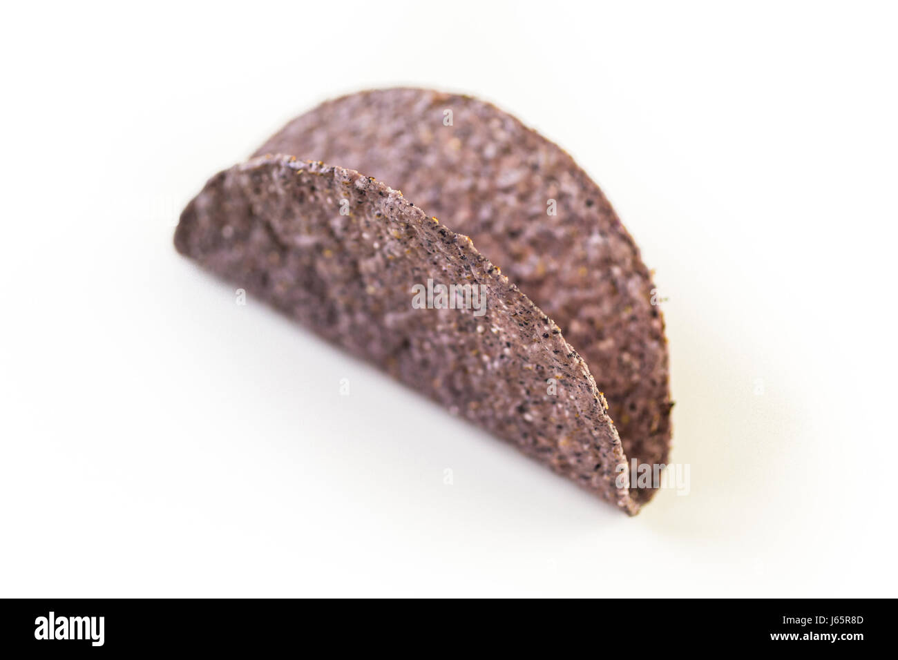 Blue corn taco shells on a white background Stock Photo - Alamy