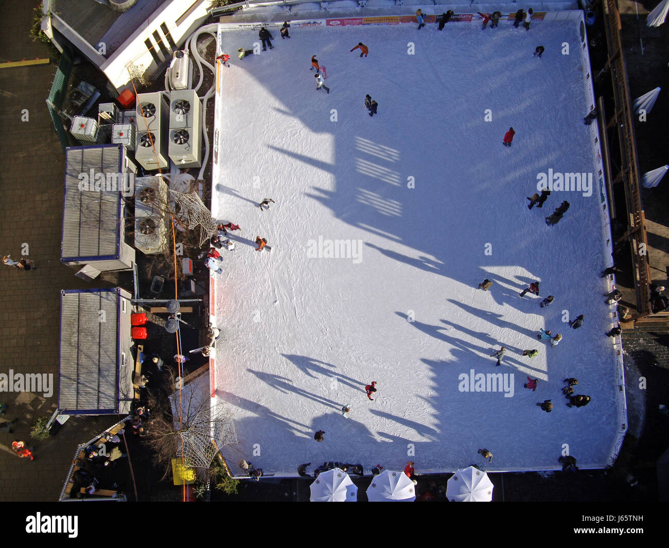 aerial perspective aerial view skate to ice-skate skating rink humans ...