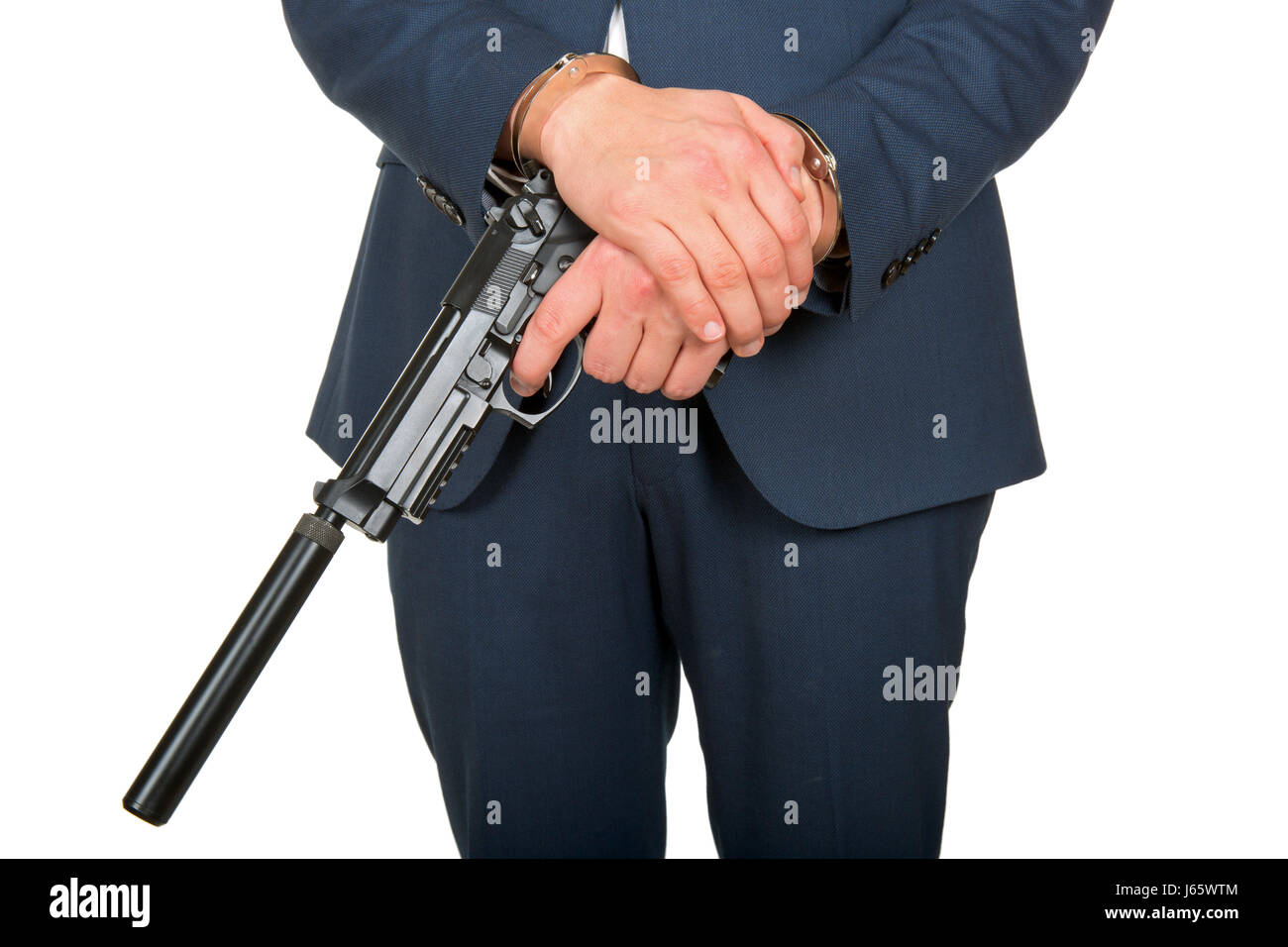 Young handsome man holding hand gun hi-res stock photography and images ...