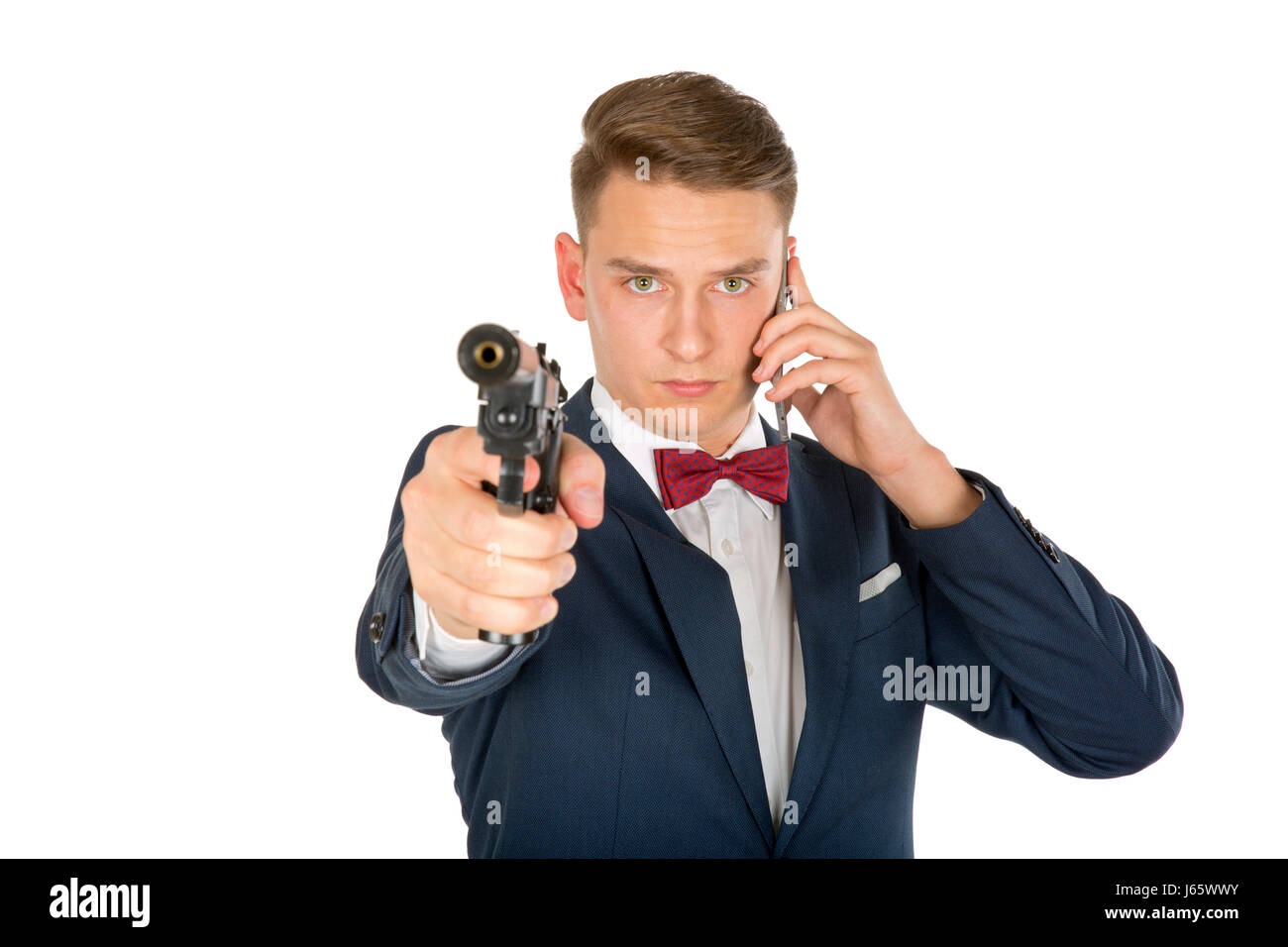 Confident businessman pointing a gun on isolated background Stock Photo ... Confident businessman pointing a gun on isolated background Stock Photo ...