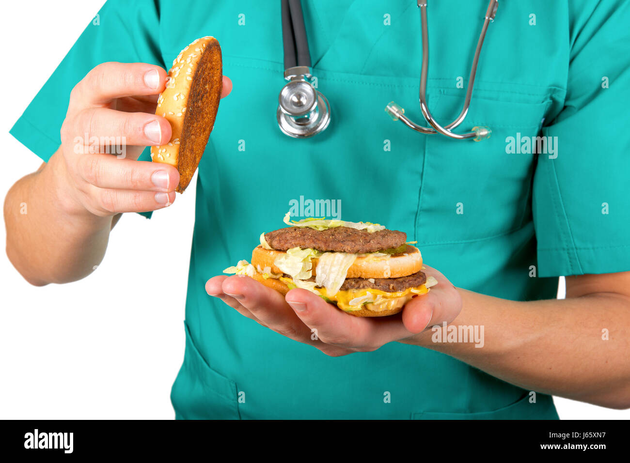 Photo of a doctor's hand holding a cheeseburger Stock Photo - Alamy