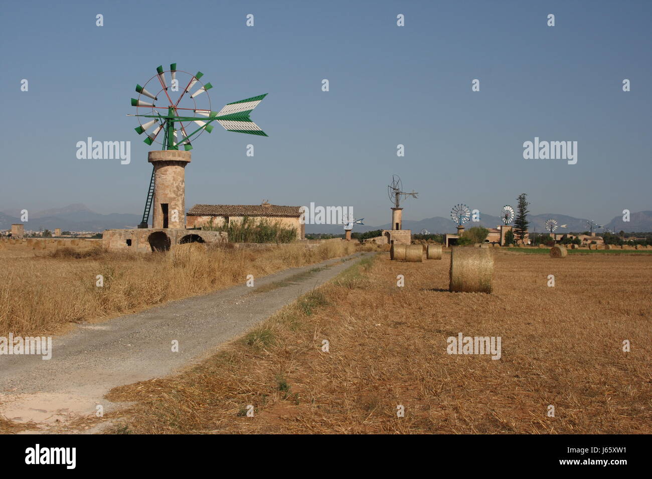 agriculture farming field mallorca windmill wind energy straw ball ...