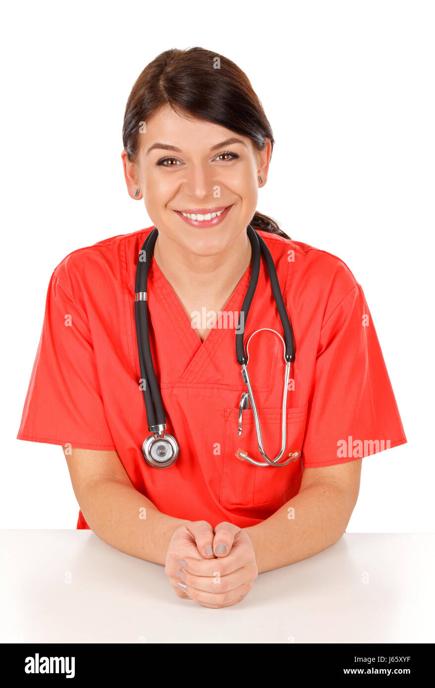 Beautiful happy female doctor wearing red lab coat posing on isolated ...