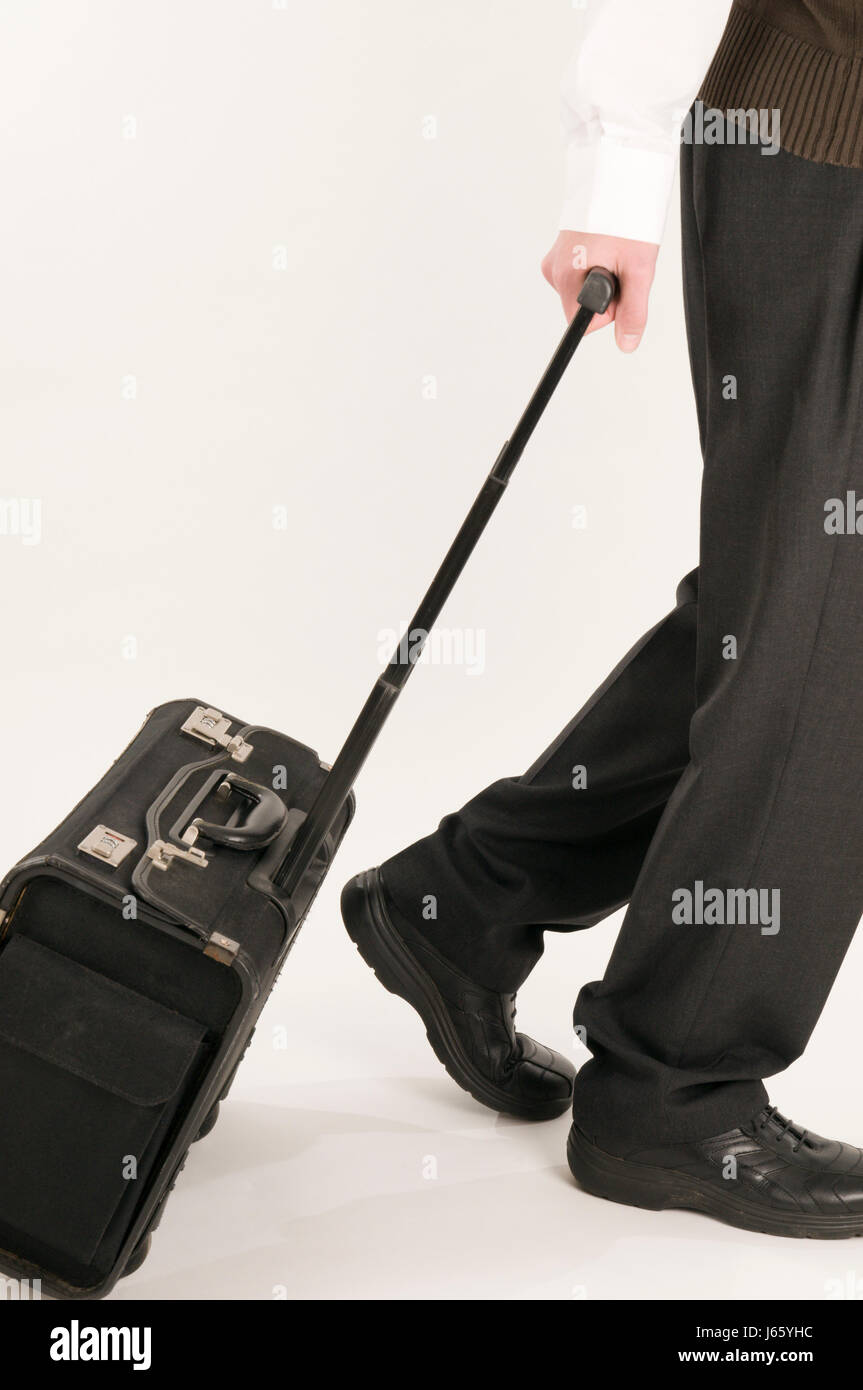 walking with suitcase vertical Stock Photo - Alamy