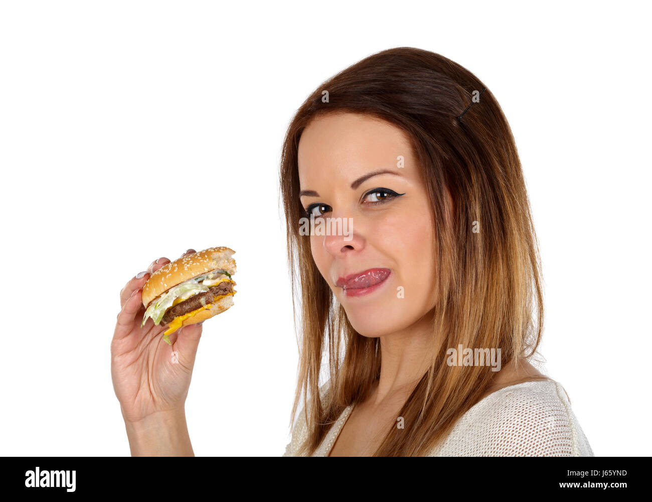 Young woman eating a delicious cheeseburger Stock Photo - Alamy