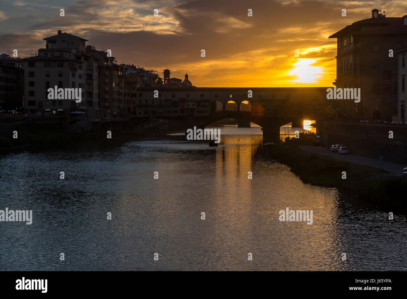 The Ponte Vecchio at sunset in Florence, Italy Stock Photo - Alamy