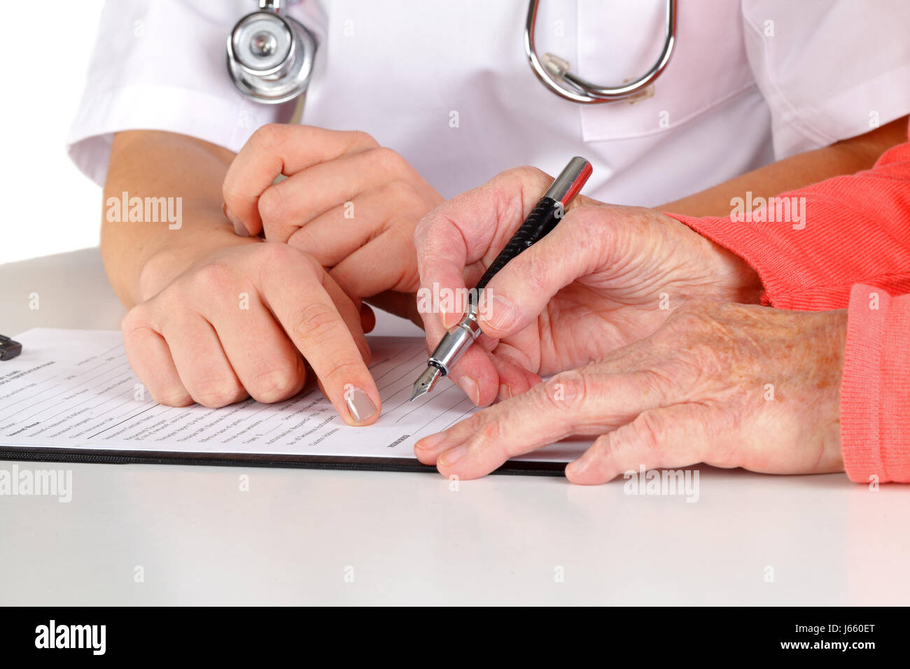 Senior hand signing on the medical examination form Stock Photo - Alamy