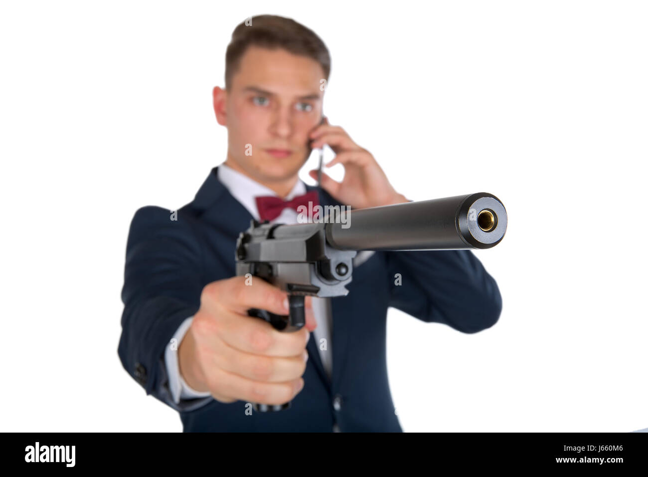 Confident businessman pointing a gun on isolated background Stock Photo ... Confident businessman pointing a gun on isolated background Stock Photo ...