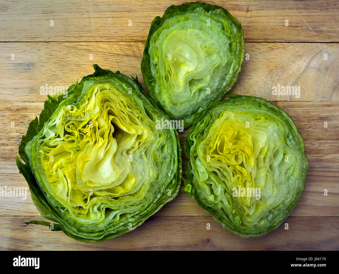 Chopped iceberg-lettuce on wood cutting board Stock Photo - Alamy
