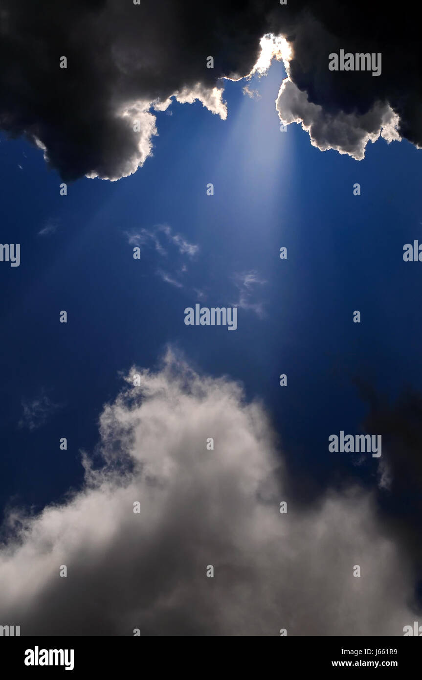 sunbeam frowningly menacing thunderclouds clouds dark weather blue ...