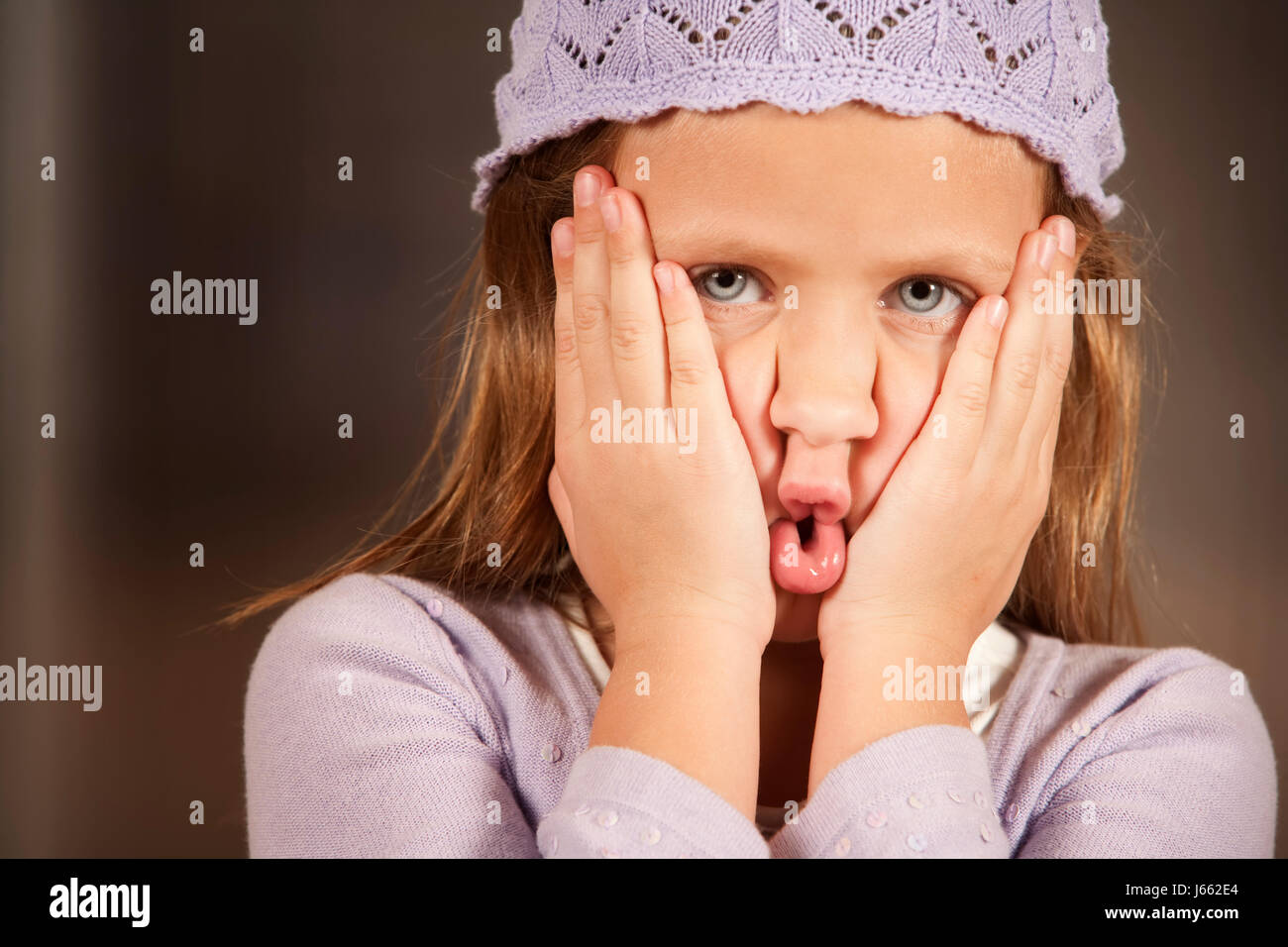 face silly expression funny kid young younger child girl girls game ...