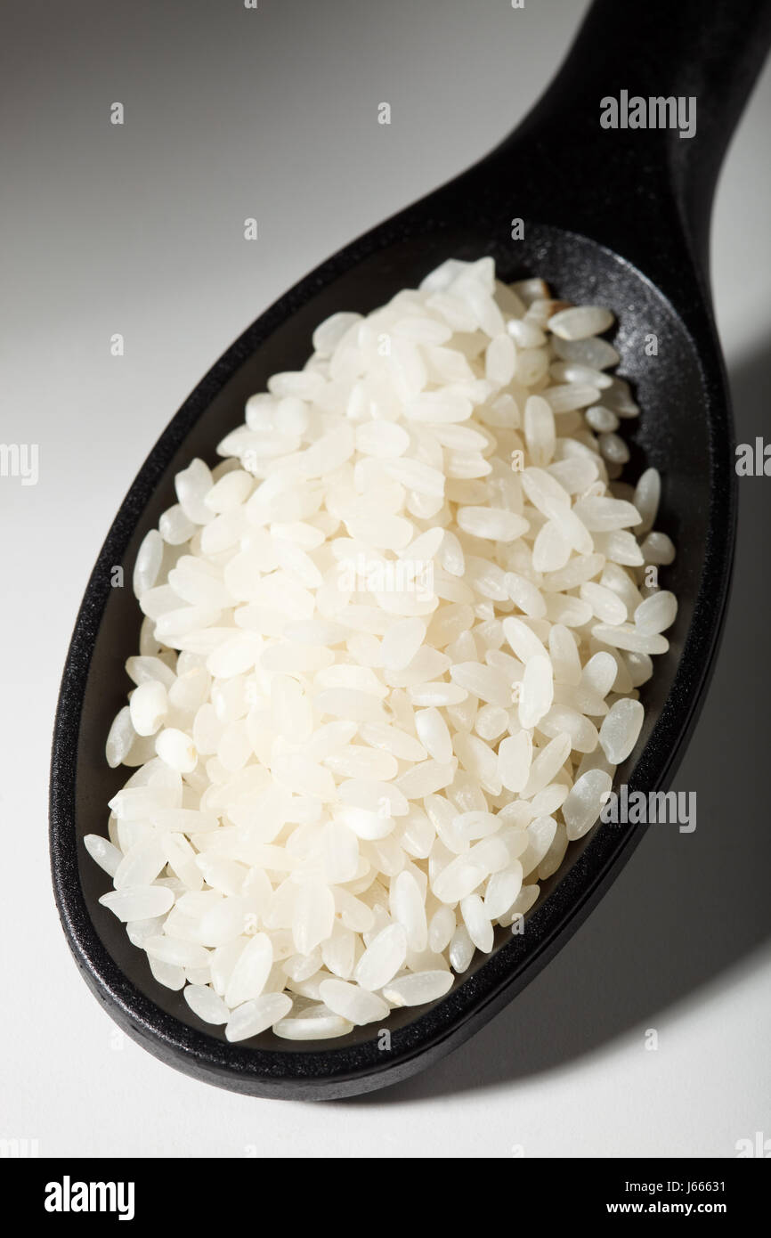 heap pile spoon rice food aliment vertical wooden spoon abundant ...