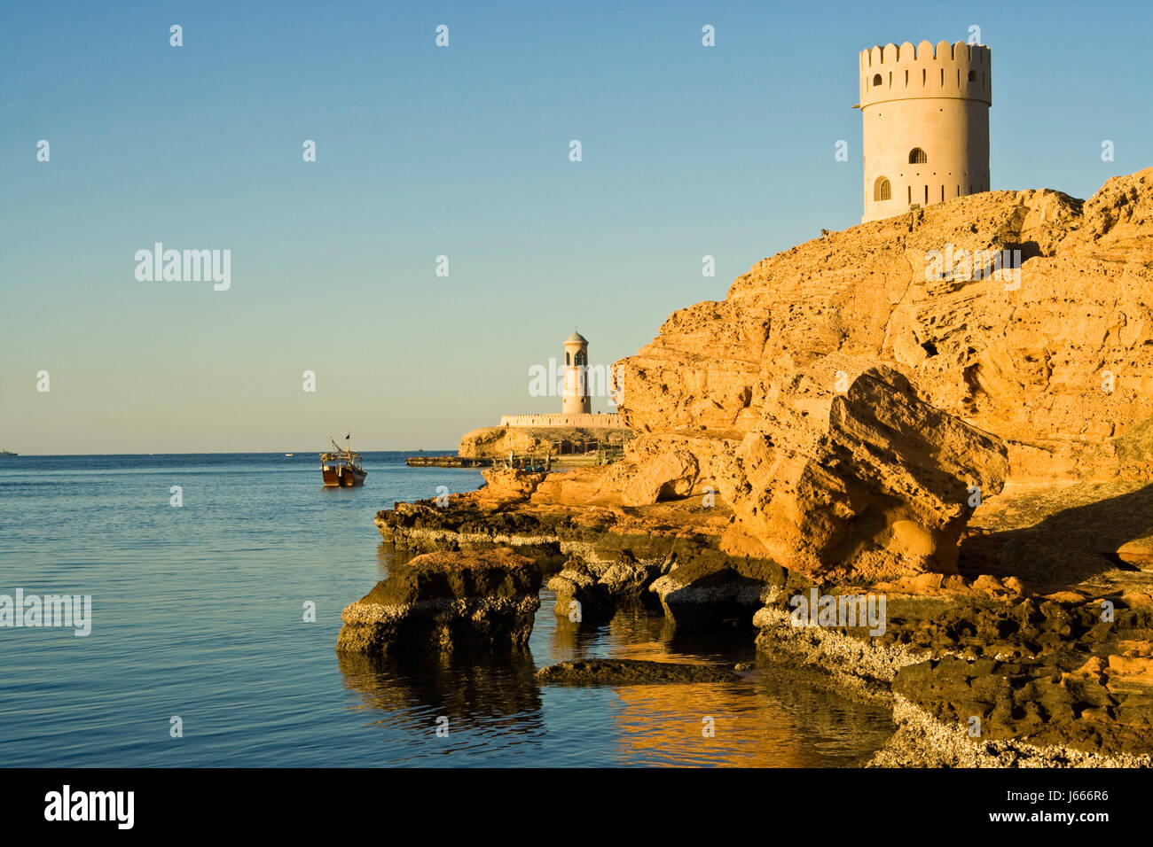 tower rock watchtower oman salt water sea ocean water mountain ...
