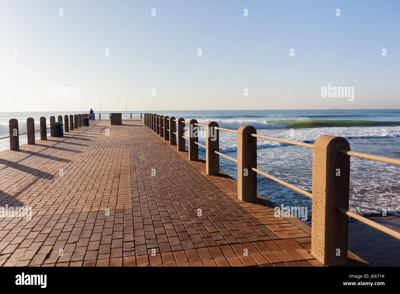 Beach Ocean Pier waves crashing scenic landscape Stock Photo - Alamy