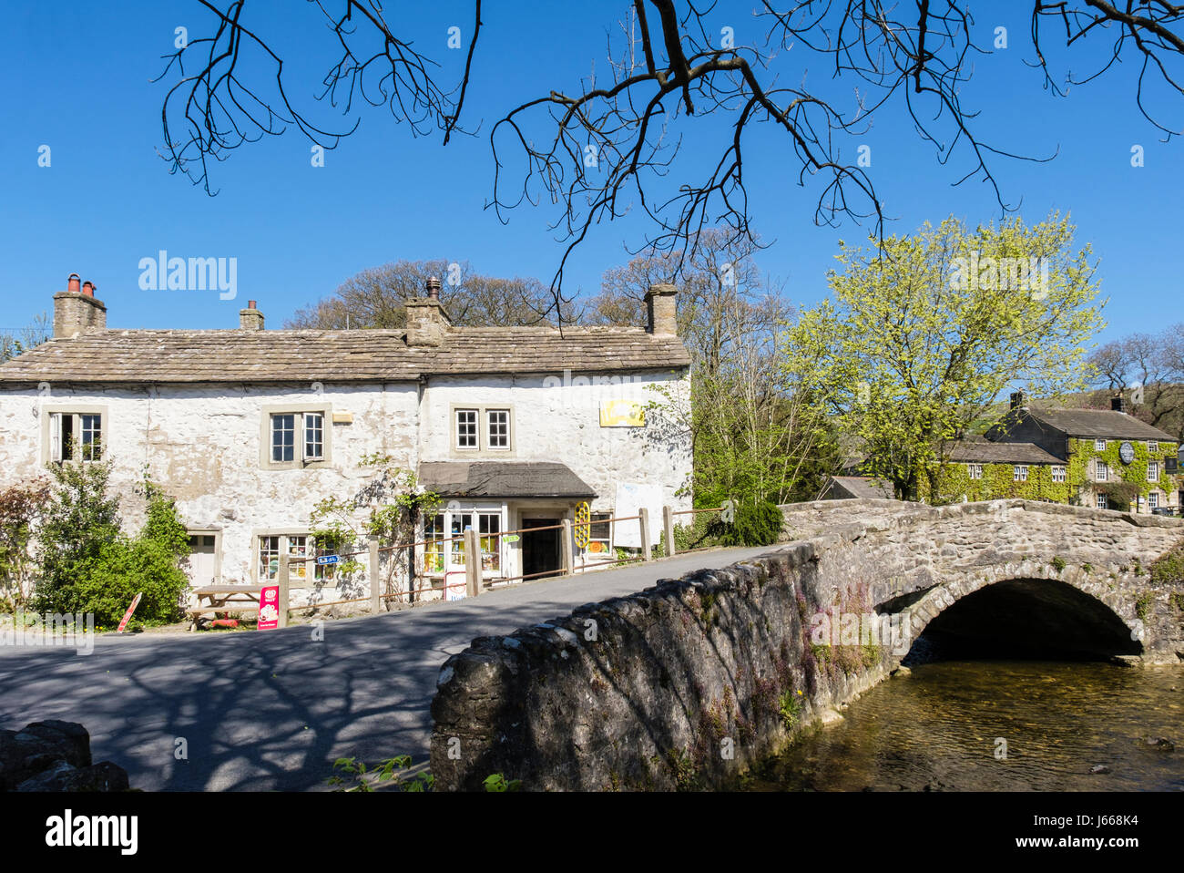 Village shop and old bridge over Malham Beck. Malham, Malhamdale ...