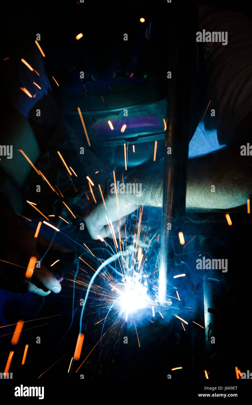 tool arc mechanic spark man bright light hand build wheel male ...