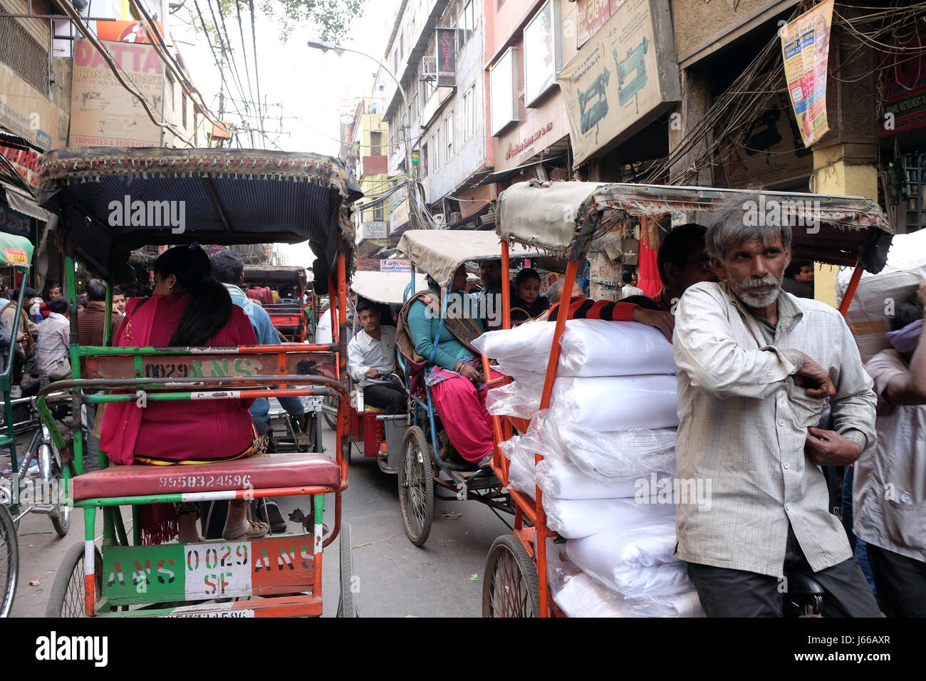 Crowded Indian side street in Old Delhi, India on February, 13, 2016 ...