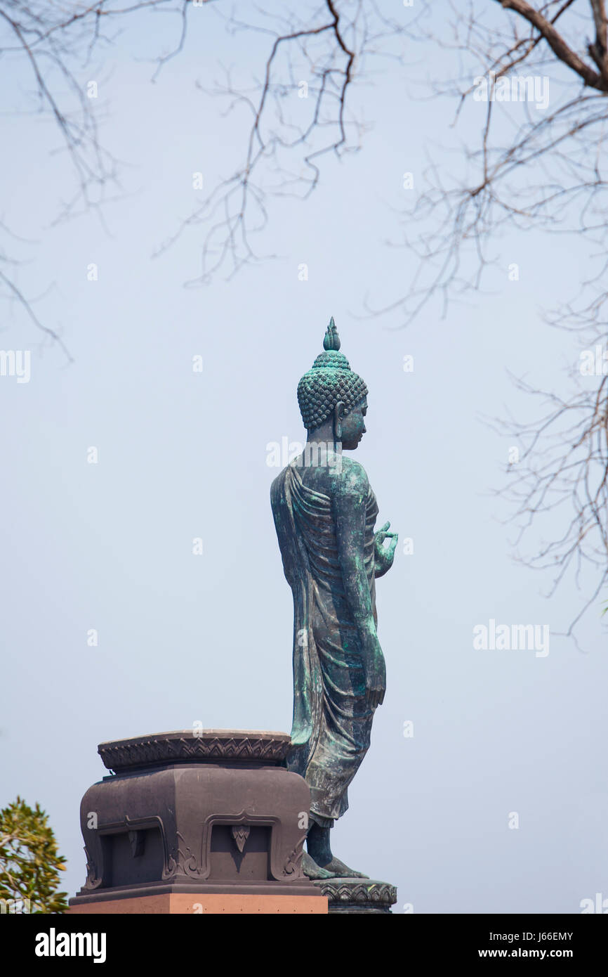 The old buddha statue stand on lotus in Thailand Stock Photo - Alamy