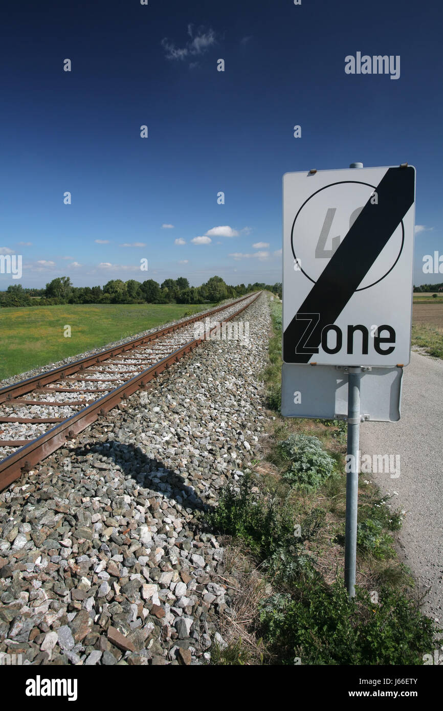 field tracks sign signal traffic sign railroad embankment railway rails ...