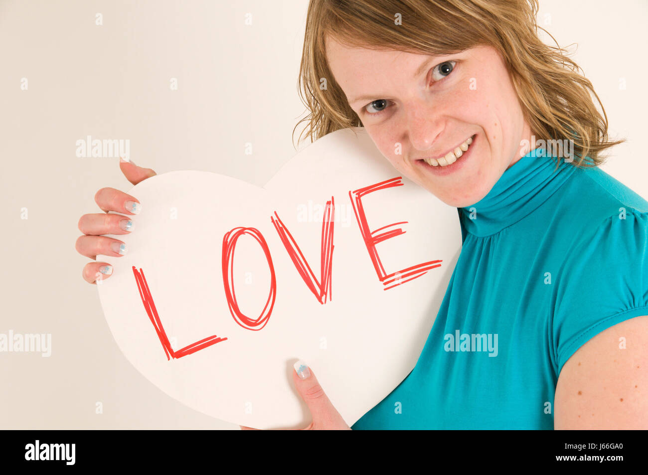 woman with white love heart Stock Photo - Alamy