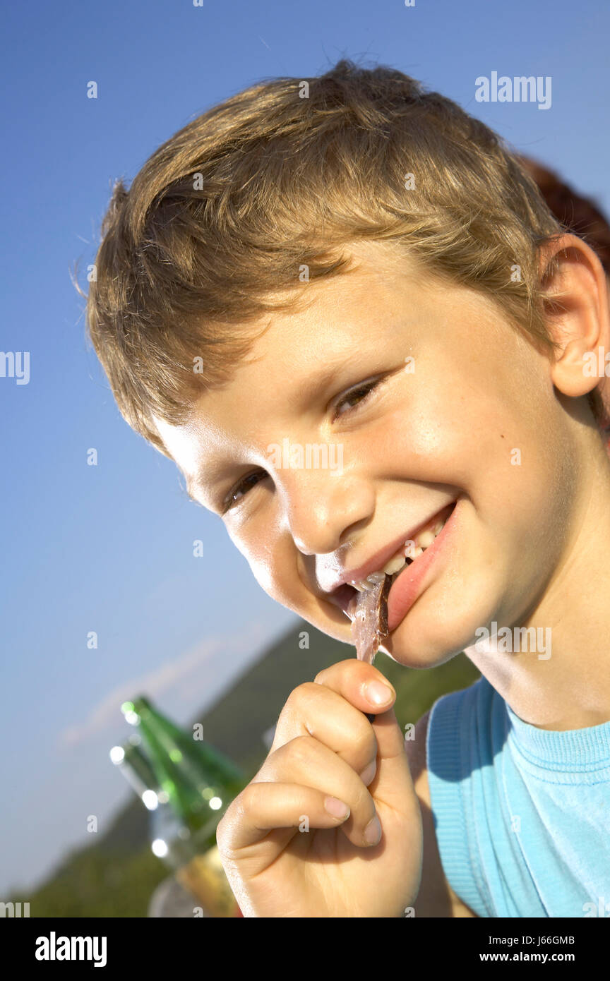 boy lad male youngster child eating eat eats nature hunger shine shines ...