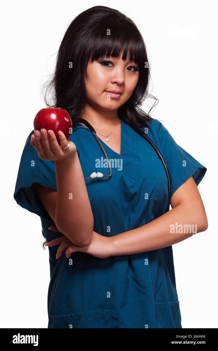 woman asian nurse eating eat eats apple healthy doctor physician medic ...