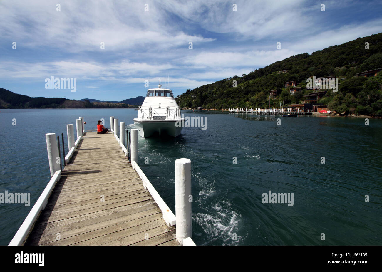 hill mountains bridge bay stakes pier salt water sea ocean water woman ...