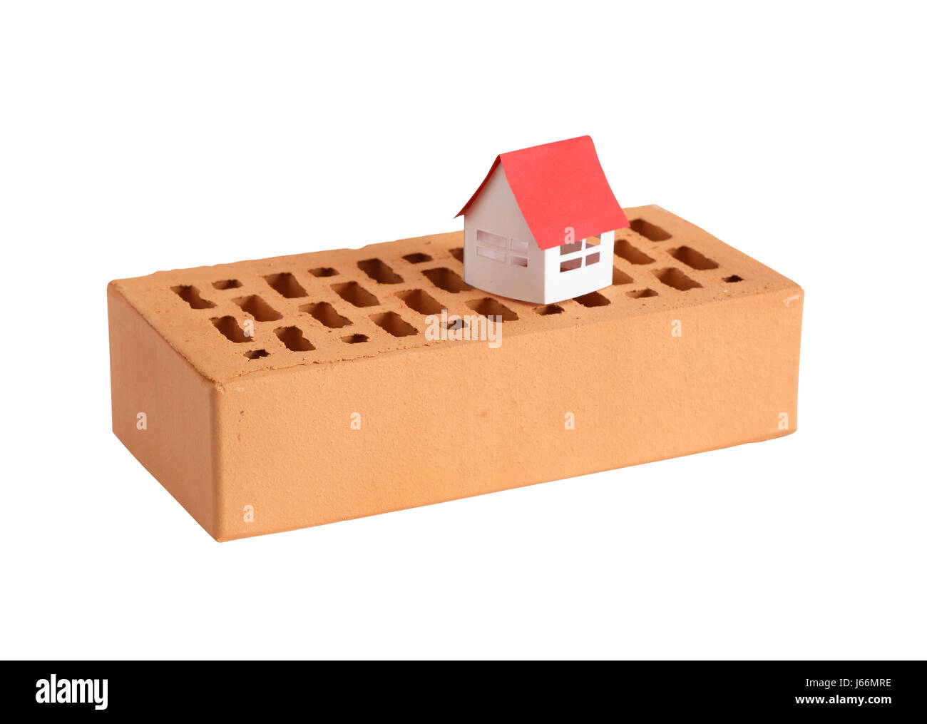 Construction concept. Small paper house standing on new brick. Isolated ...