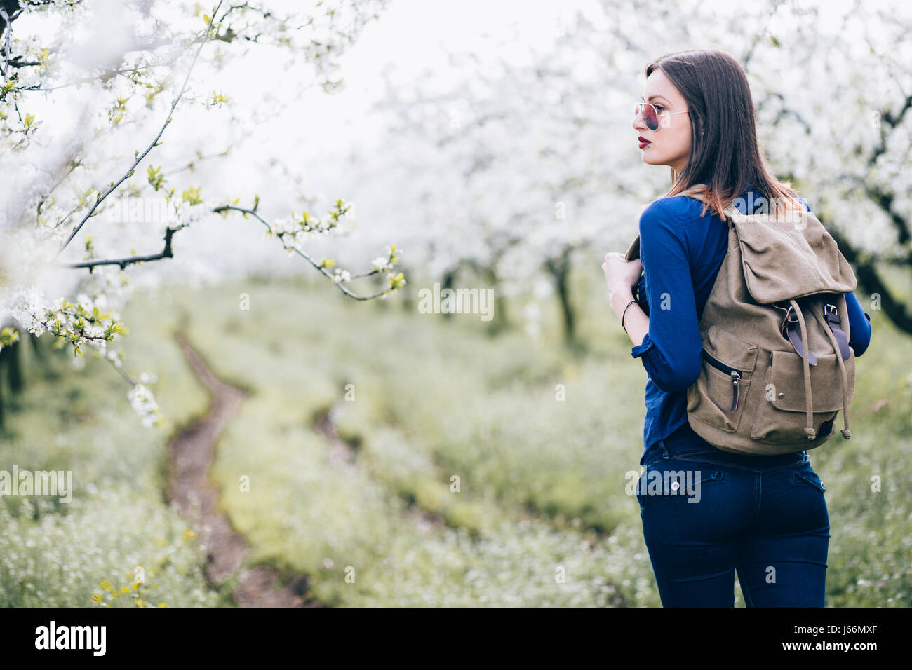 Young woman walking in nature Stock Photo - Alamy