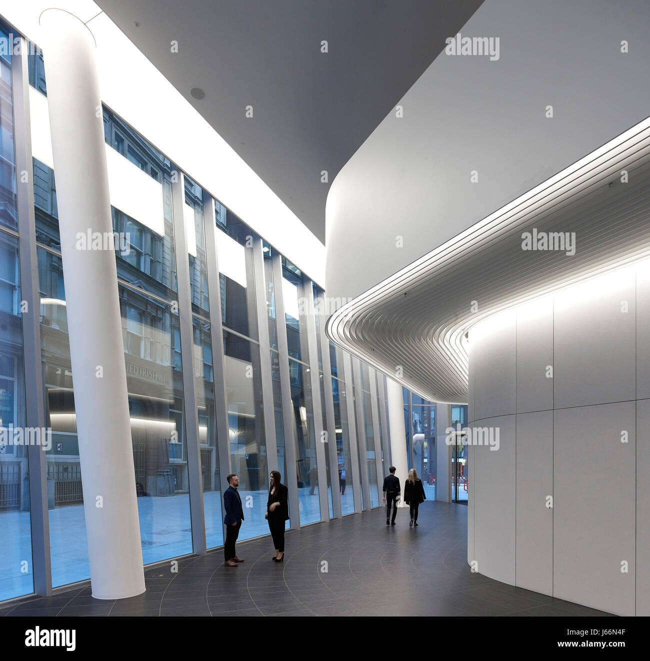 Ground floor reception area with people. Angel Court, London, United ...