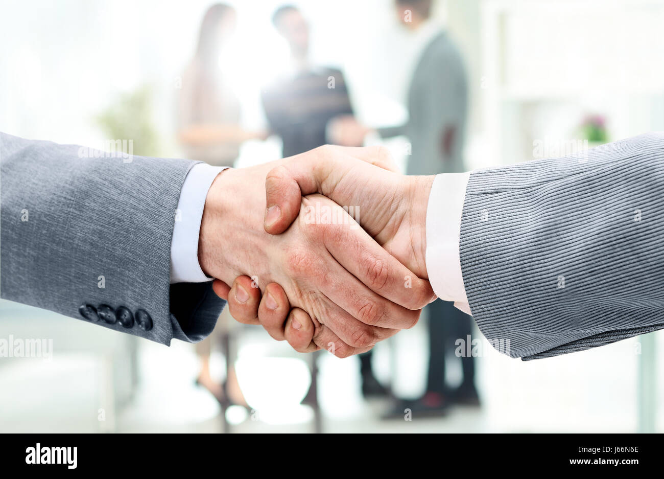 handshake of business partners after discussion of the financial Stock ...