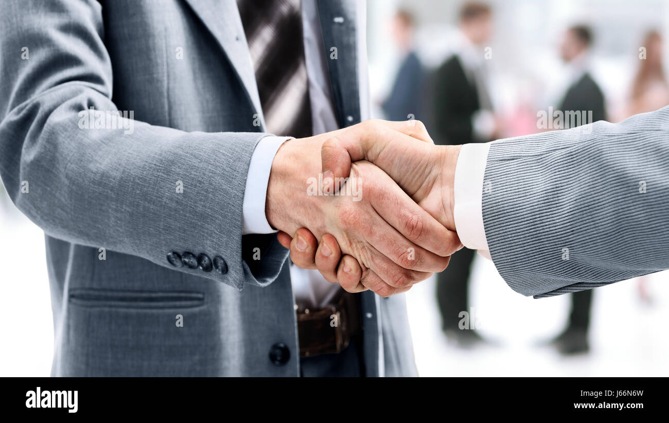 handshake of business partners after discussion of the financial Stock ...